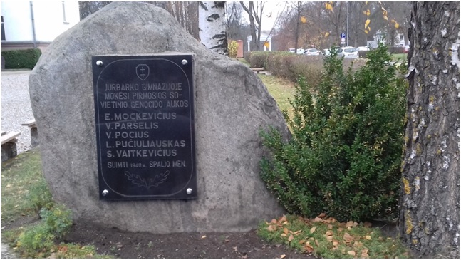 A memorial stone for five high school students